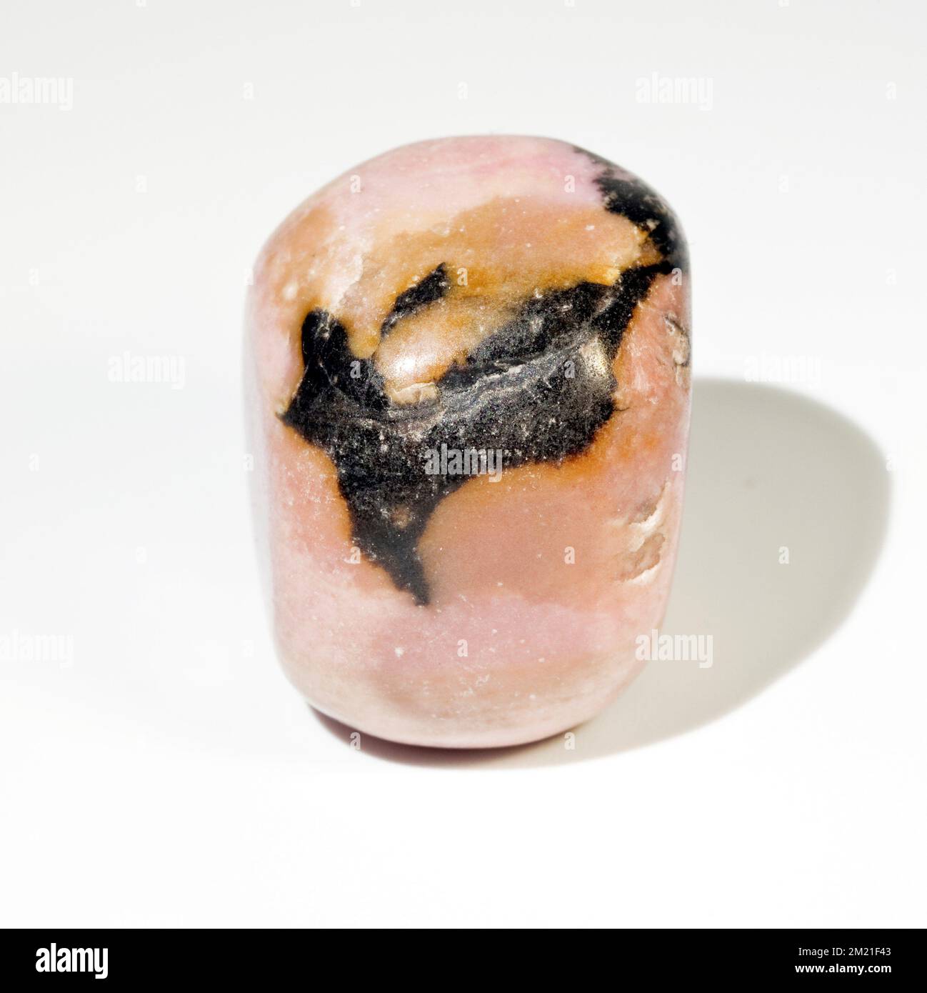 Macro close up colour photograph of 'Rhodonite' a semi precious crystal ...