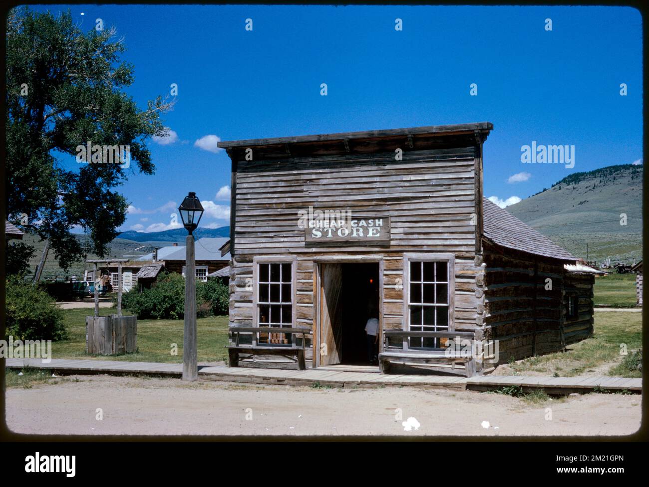 Building with 'Cheap Cash Store' sign in hilly landscape, Nevada City ...