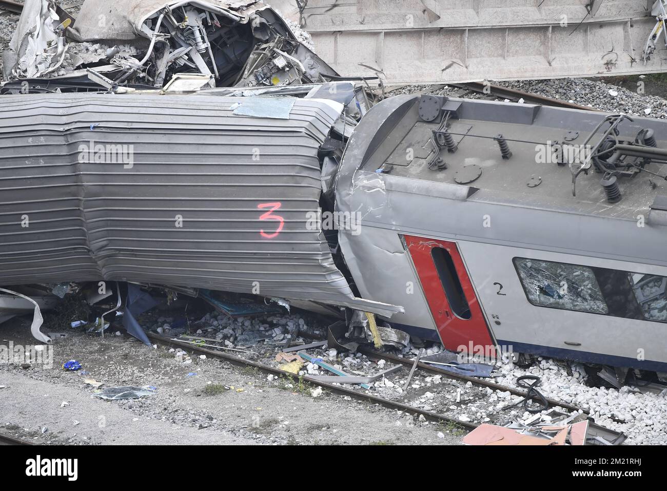 Train wreckages pictured at the scene of a train collision between a ...