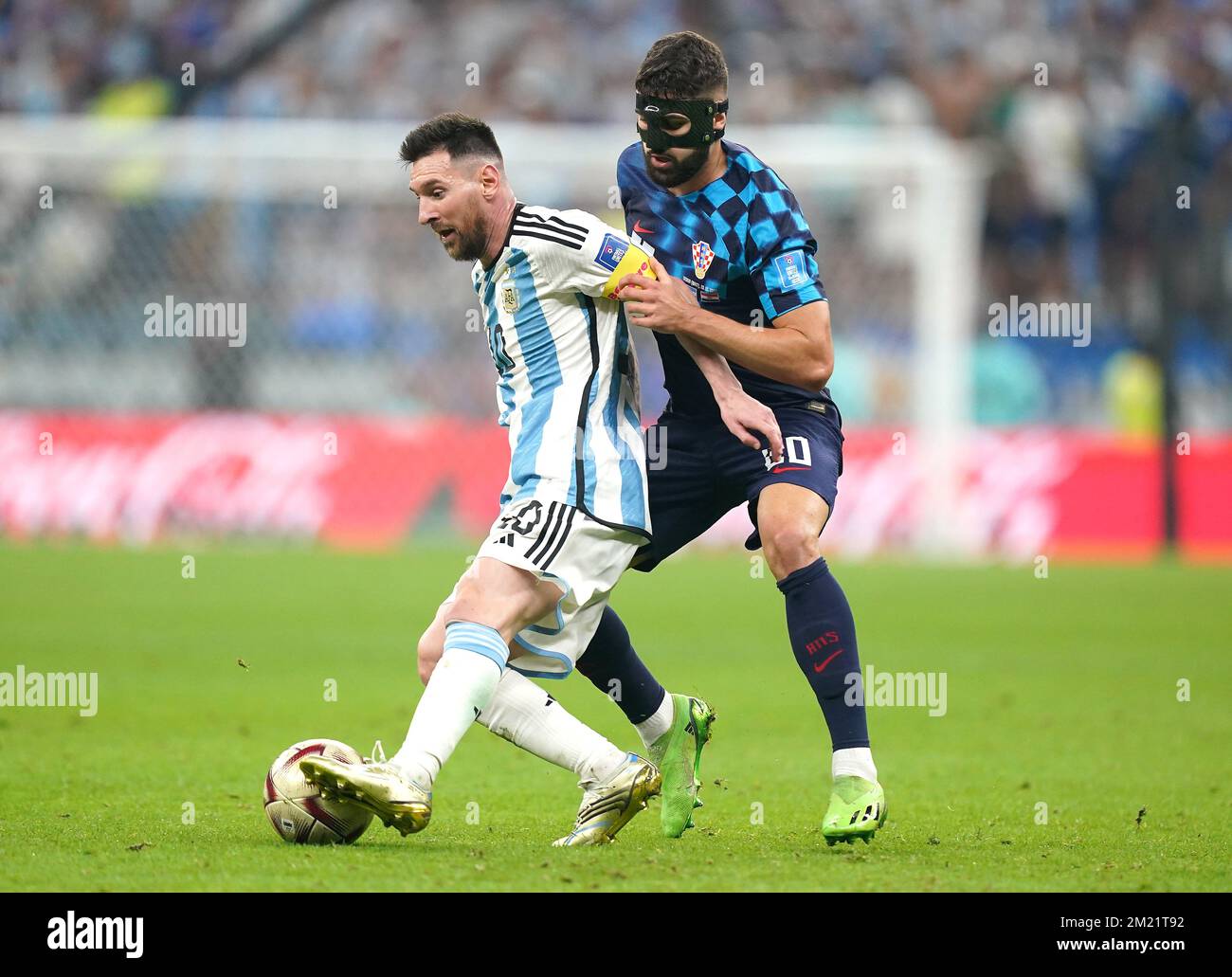 Argentina's Lionel Messi (left) and Croatia's Josko Gvardiol battle for ...