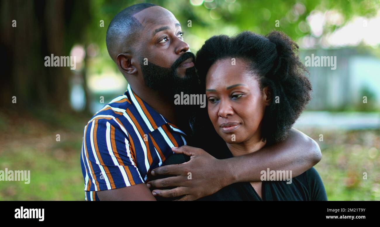 Beautiful romantic black couple. Man hugging woman Stock Photo - Alamy