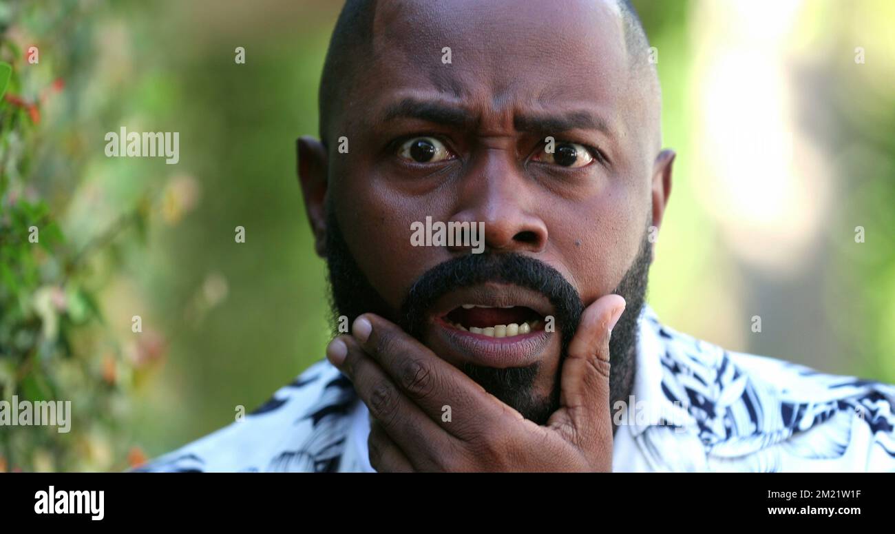 Black man SHOCK terror emotion. unbelief African person in DESPAIR ...