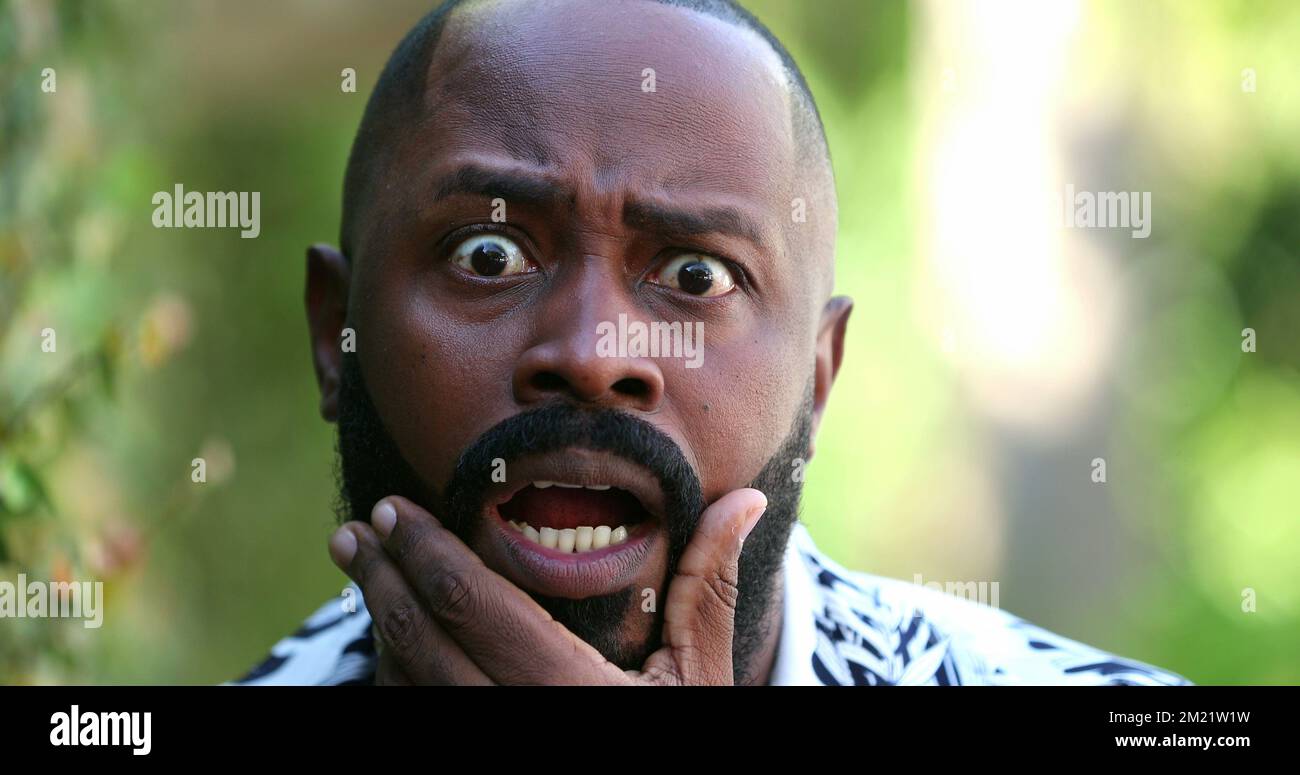 Black man SHOCK terror emotion. unbelief African person in DESPAIR ...