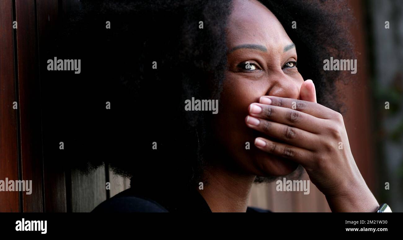 Black woman natural real lfe laugh, person laughter covering mouth with ...