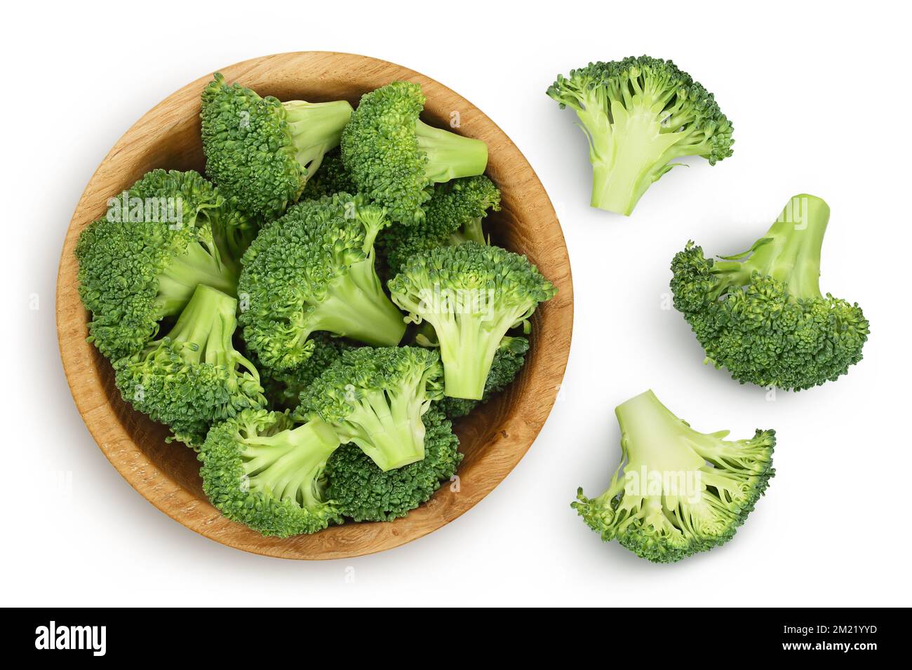 fresh broccoli in wooden bowl isolated on white background close-up ...