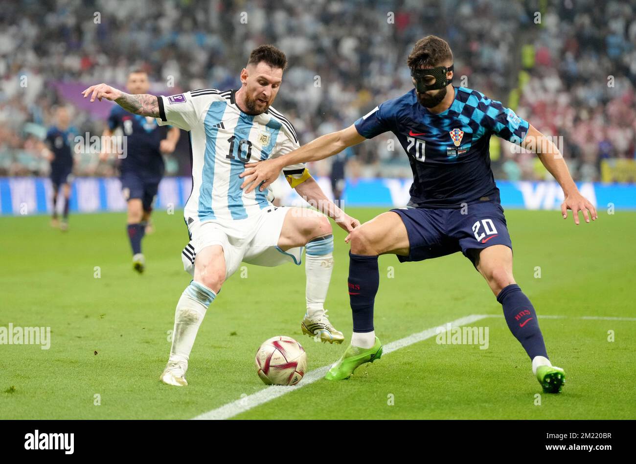 Argentina's Lionel Messi (left) and Croatia's Josko Gvardiol battle for ...