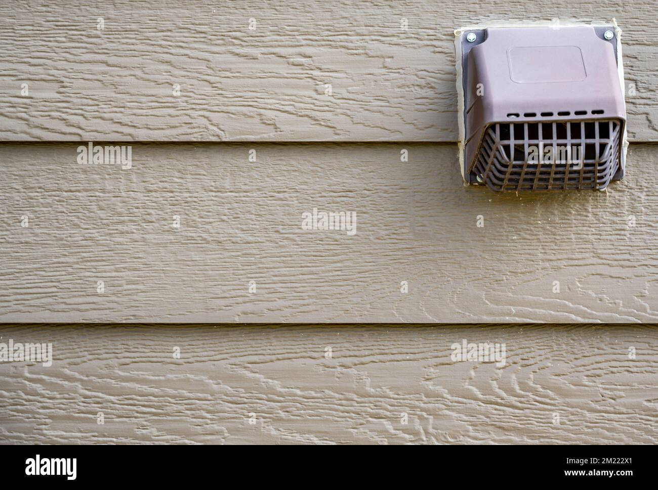 Residential vent pest screen on the side of a house Stock Photo - Alamy