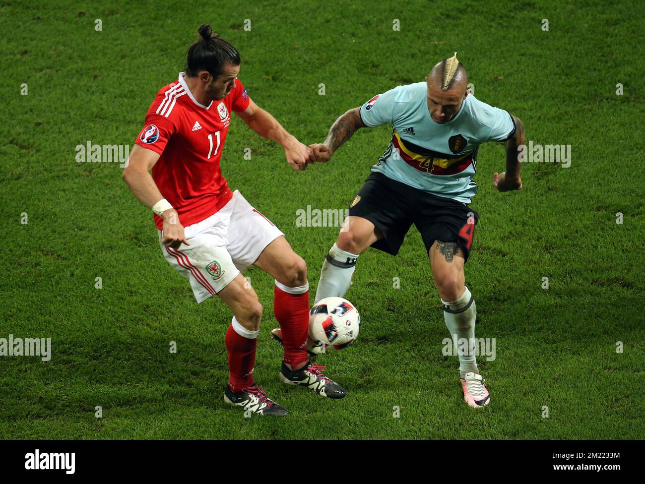 Wales' Gareth Bale and Belgium's Radja Nainggolan fight for the ball ...