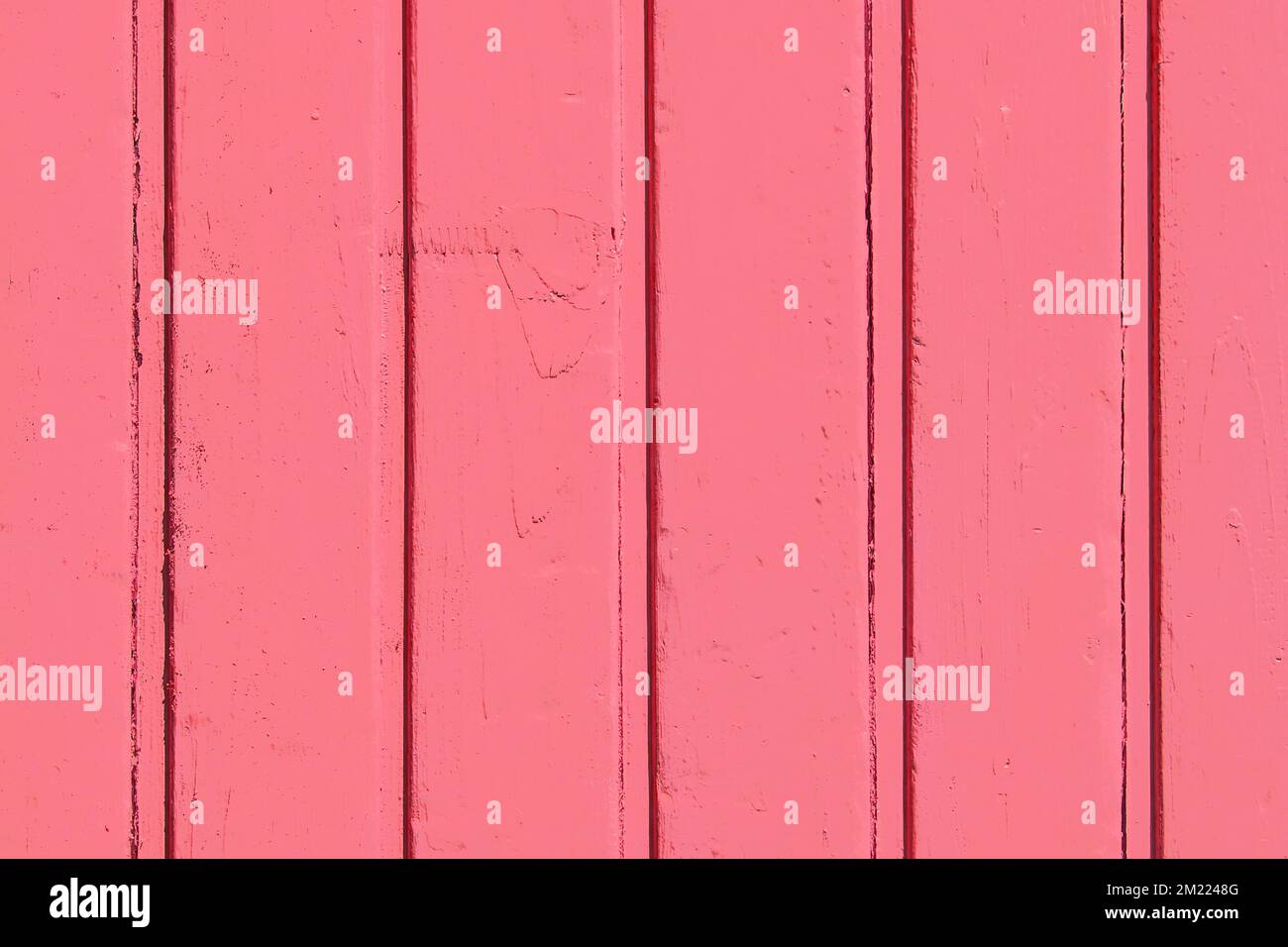 Vertical boards in light red crimson color paint wooden surface texture ...