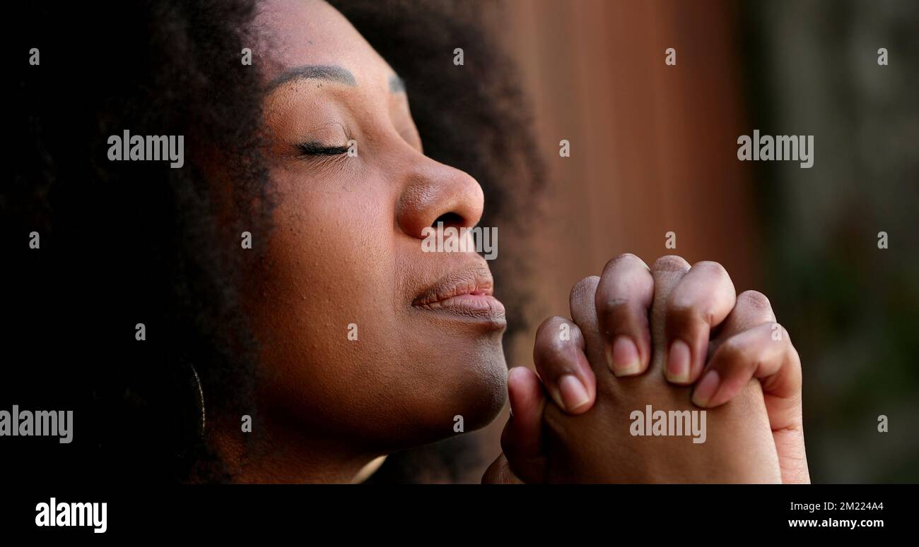 Happy smiling African woman feeling HOPE and FAITH Stock Photo - Alamy