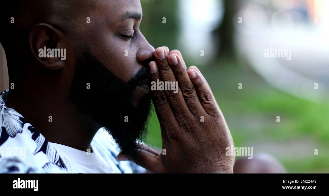 Happy pensive spiritual African man feeling positive and hopeful3 Stock ...