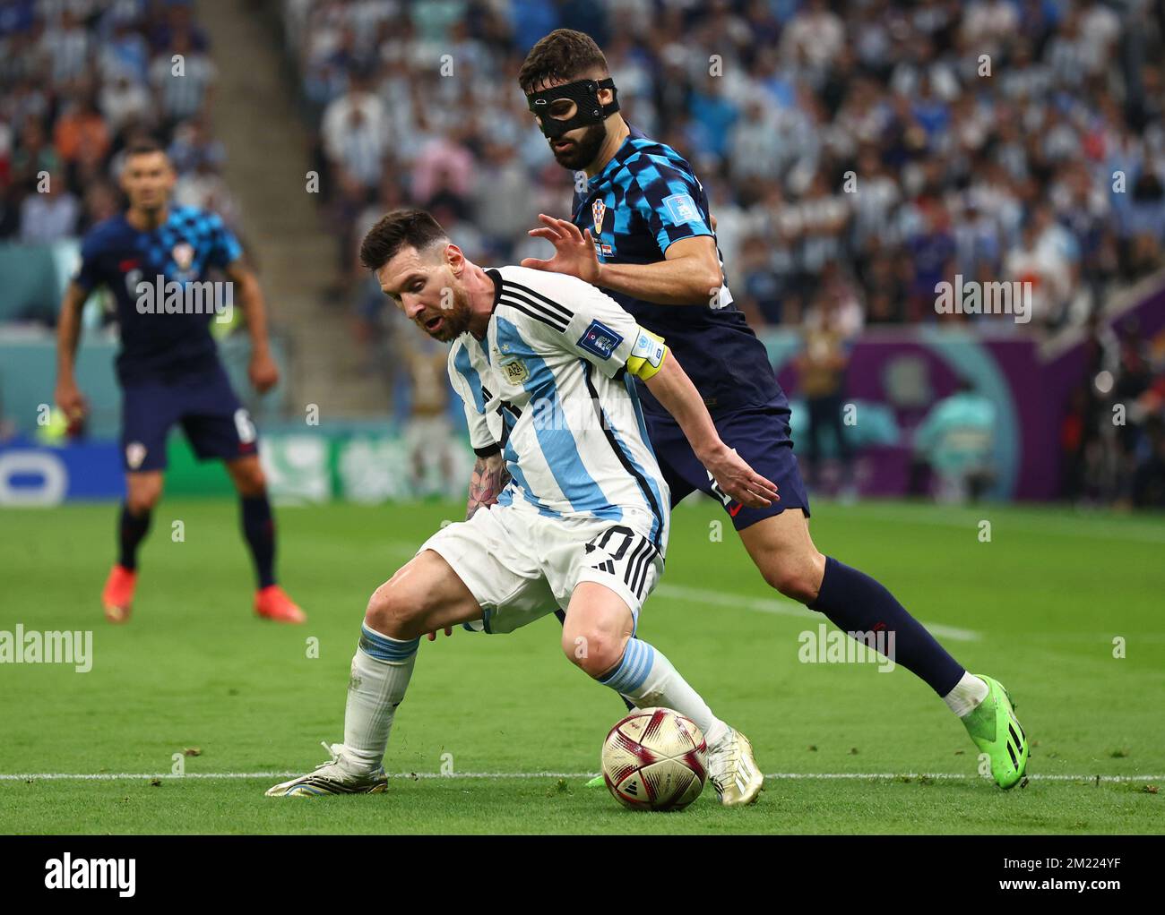 Doha, Qatar, 13th December 2022. Lionel Messi of Argentina tussles with ...