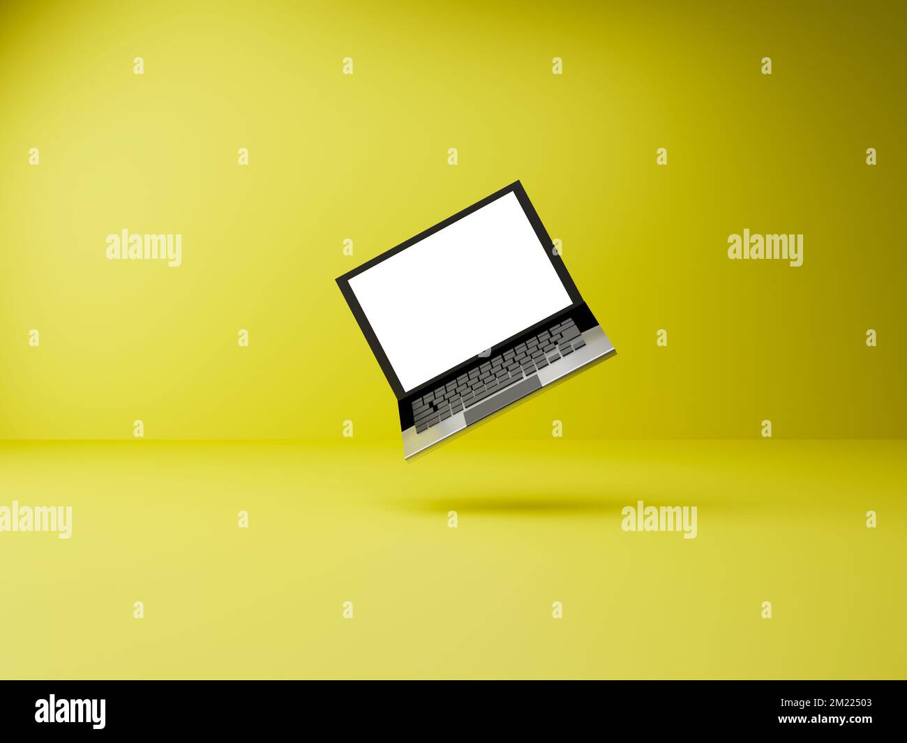 Laptop floating in the air on yellow background Stock Photo - Alamy