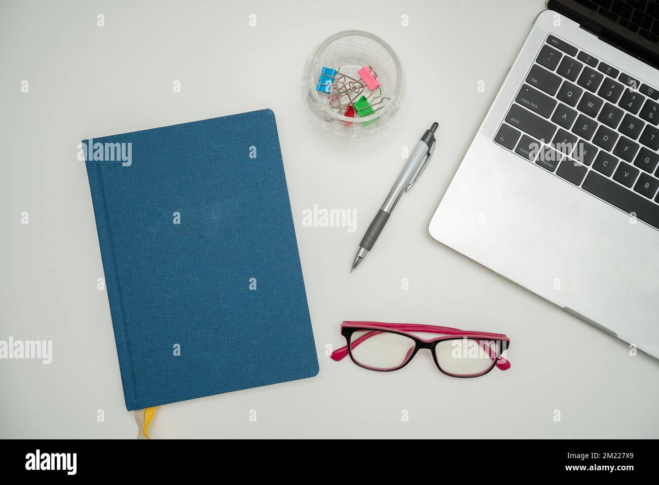 Office Supplies Over Desk With Keyboard And Glasses And Coffee Cup For ...