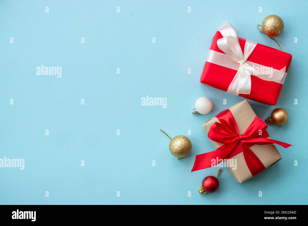 Christmas presents on blue background top view Stock Photo - Alamy
