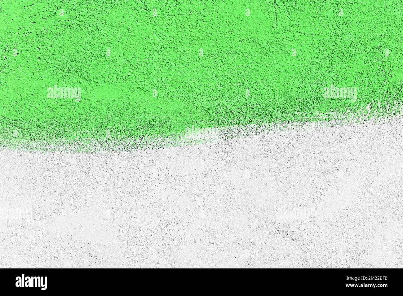 Wall two tone colors: green verdant and white paint on concrete surface ...