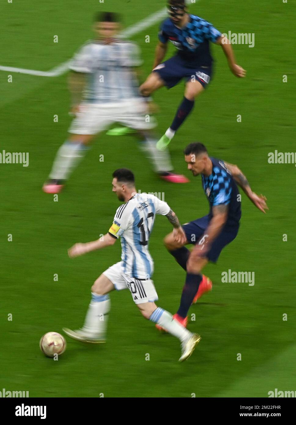 Lusail, Qatar. 13th Dec, 2022. Lionel Messi (bottom) of Argentina ...