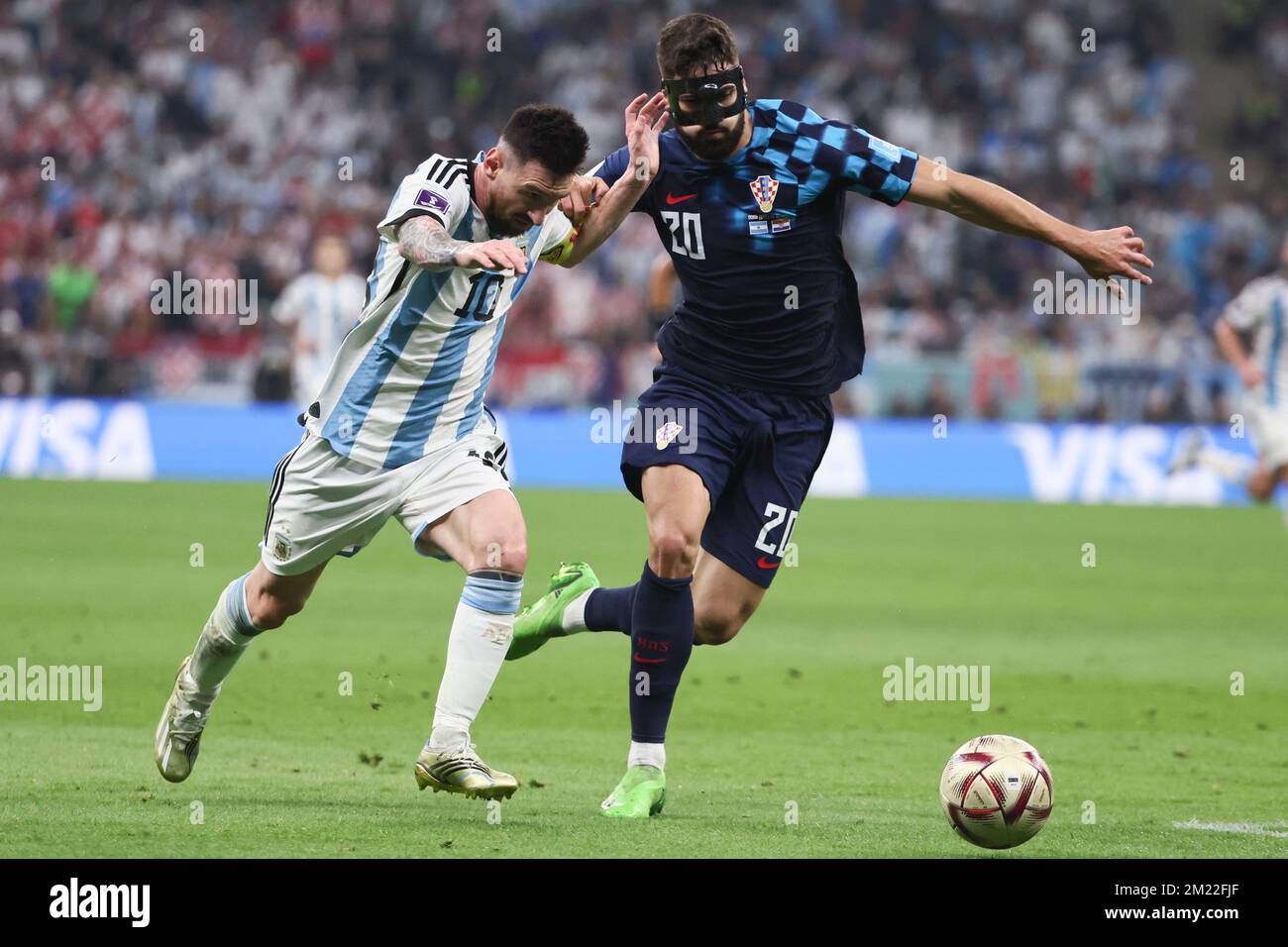 Lusail, Qatar. 13th Dec, 2022. Lionel Messi (L) of Argentina vies with ...