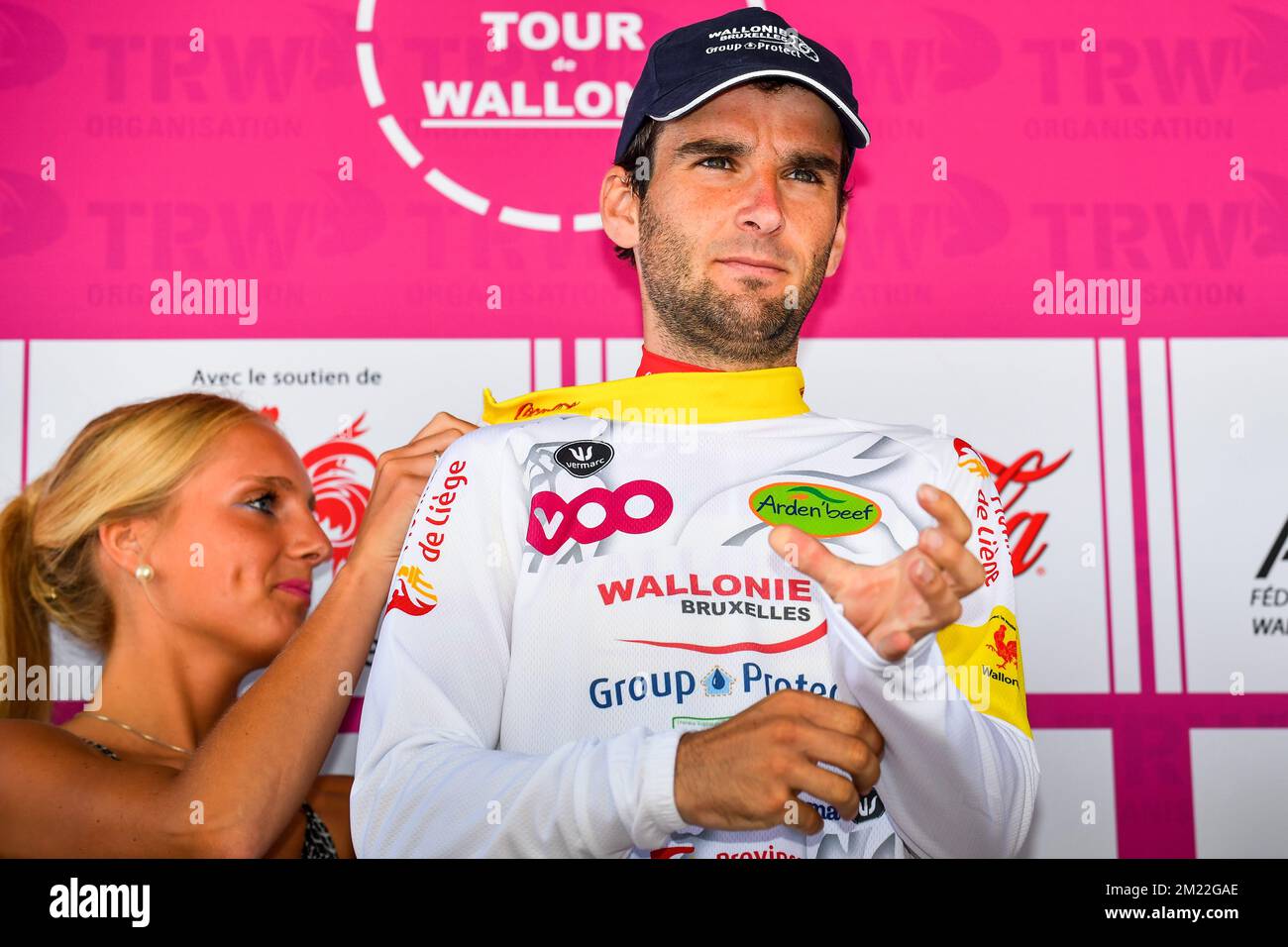 Belgian cyclist Baptiste Planckaert celebrates on the podium wearing ...