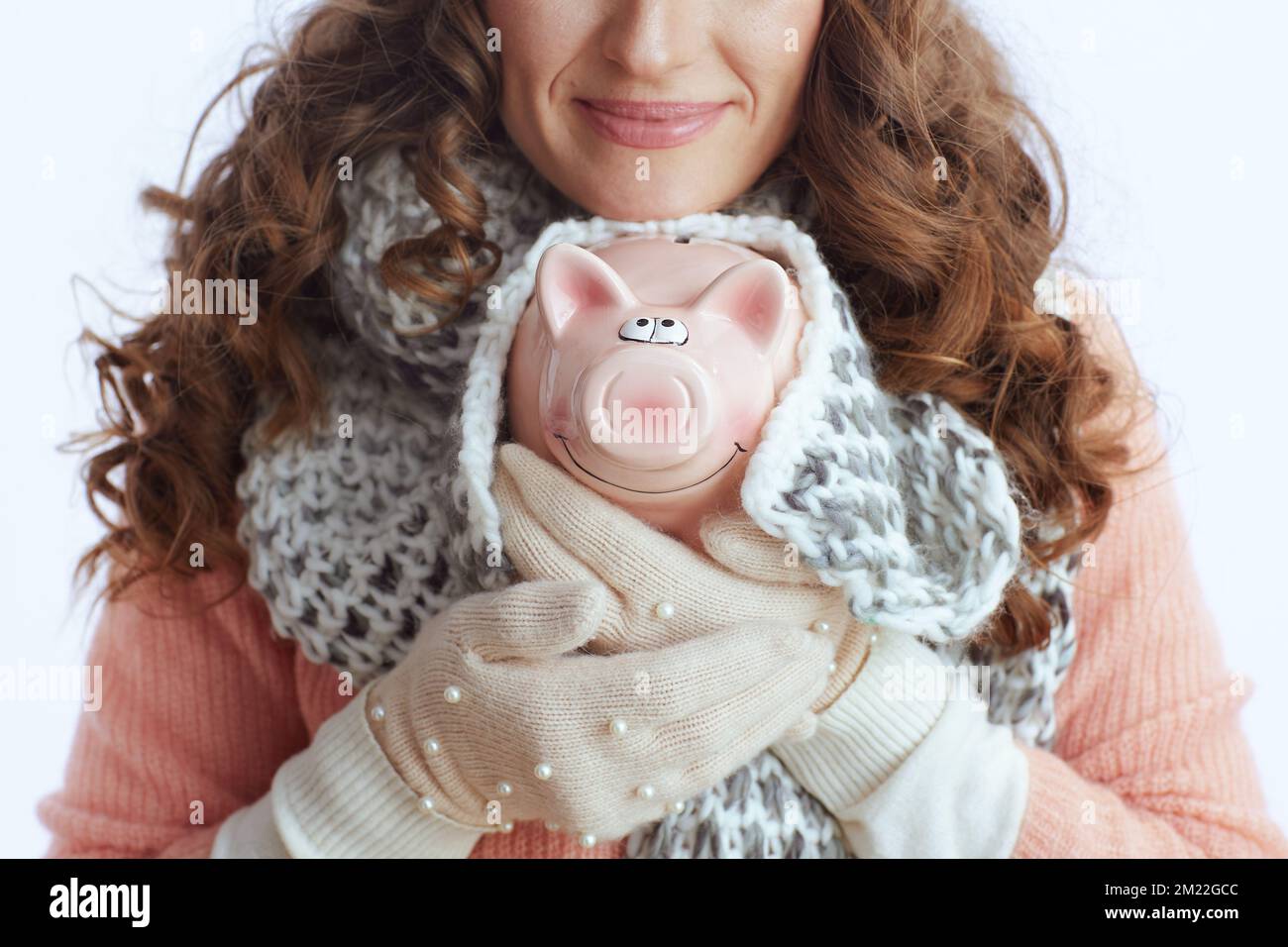 Hello winter. Closeup on trendy 40 years old woman in sweater, mittens ...