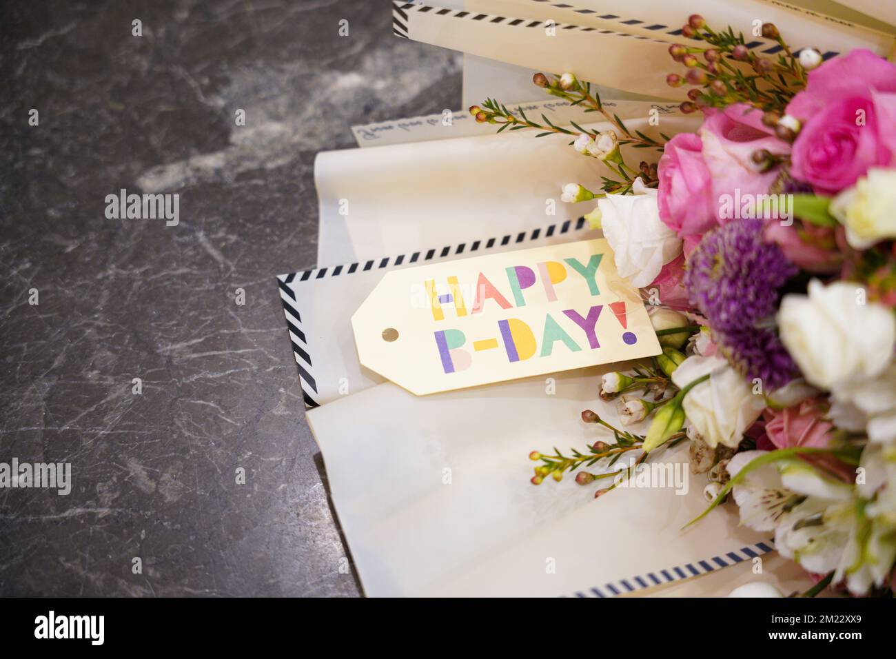 Happy Birthday pink and purple flower bouquet with birthday card and ...