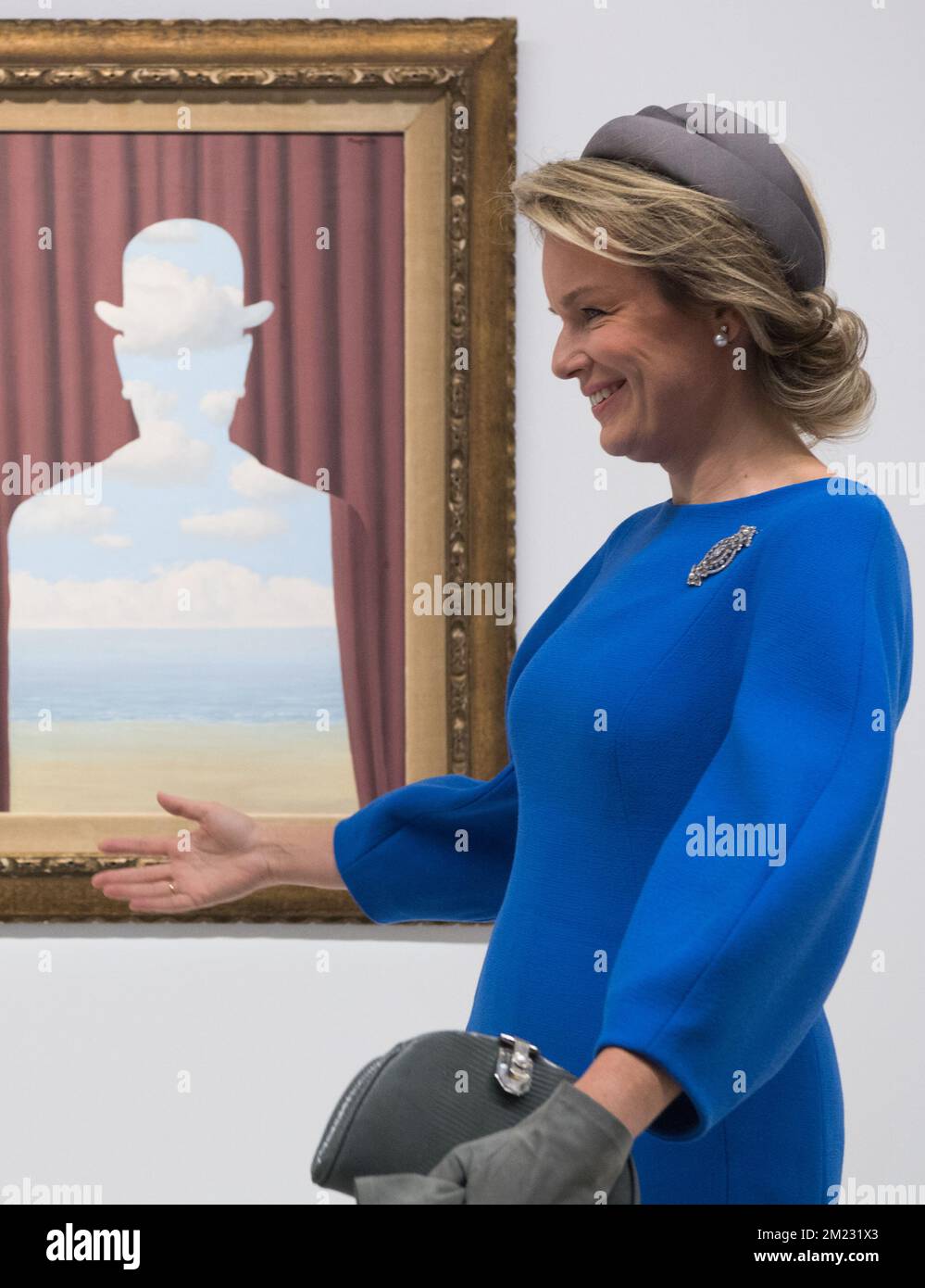 Queen Mathilde of Belgium poses for the photographer with a Magritte ...