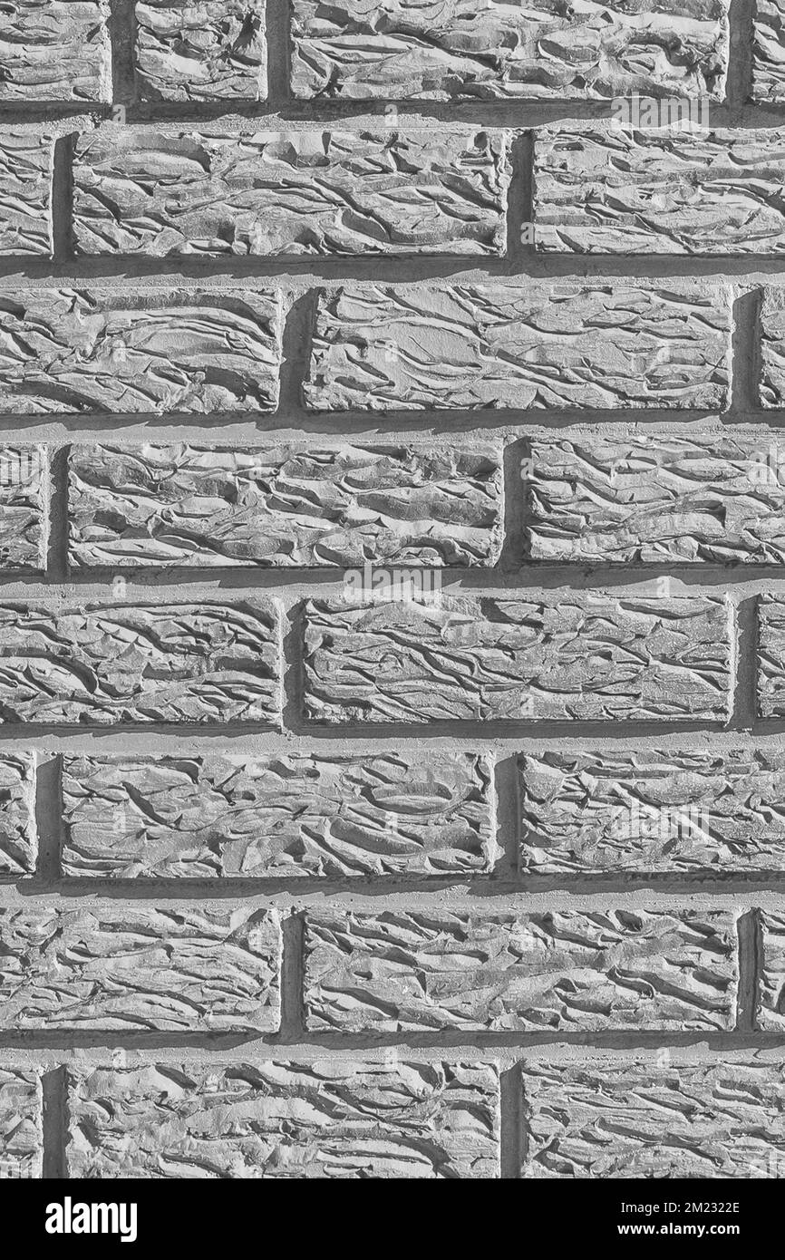 Grey brick wall with abstract decorative stucco plaster pattern modern ...