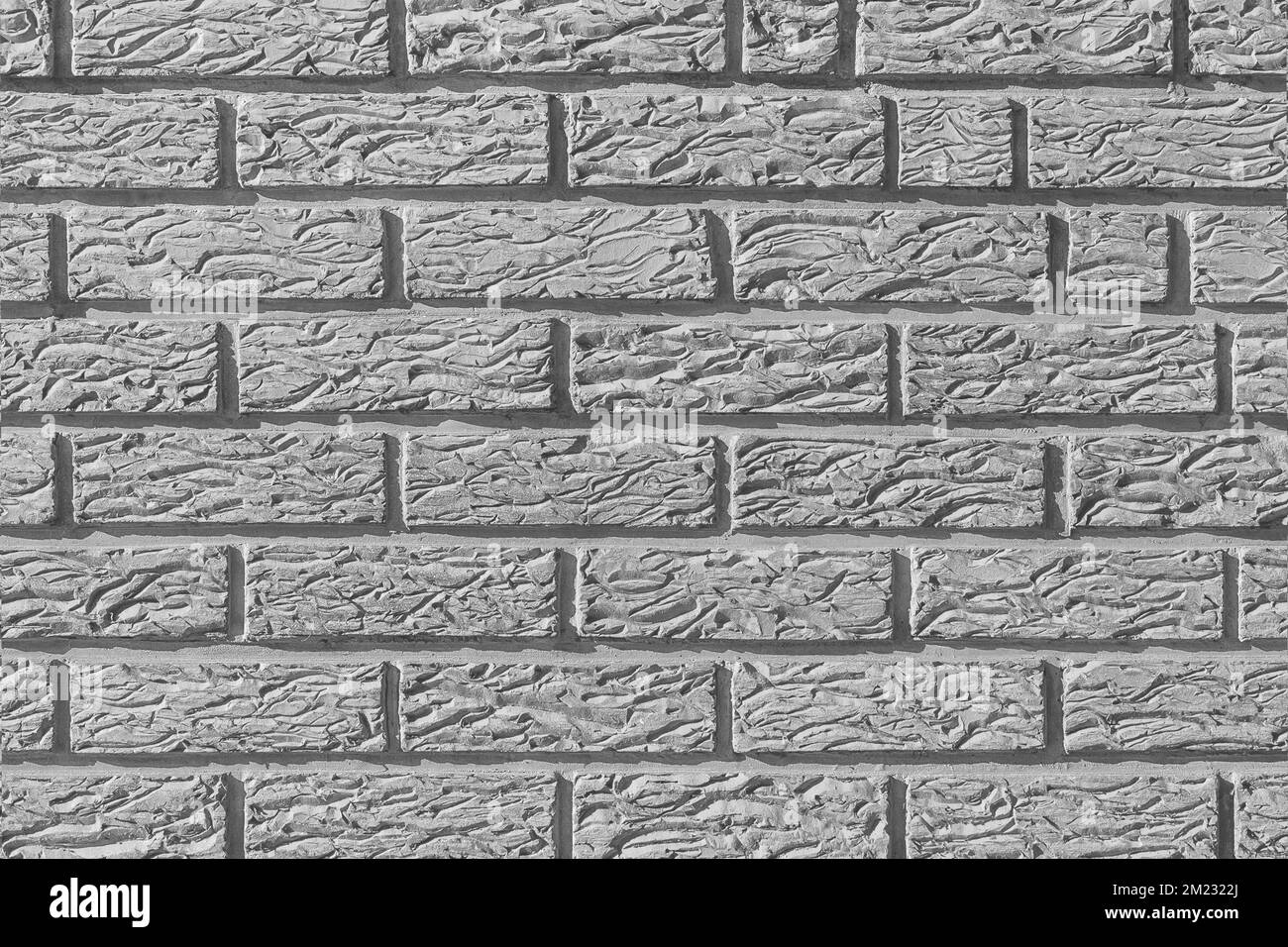 Grey brick wall with abstract decorative stucco plaster pattern modern ...