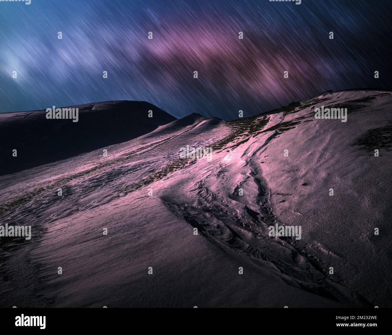 snowy landscape in winter season during night with a milky way ...