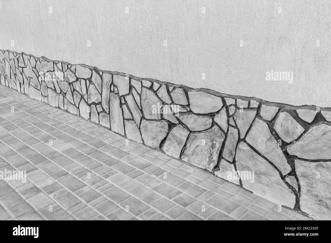 Facade of modern building with grey plaster wall, stone abstract ...