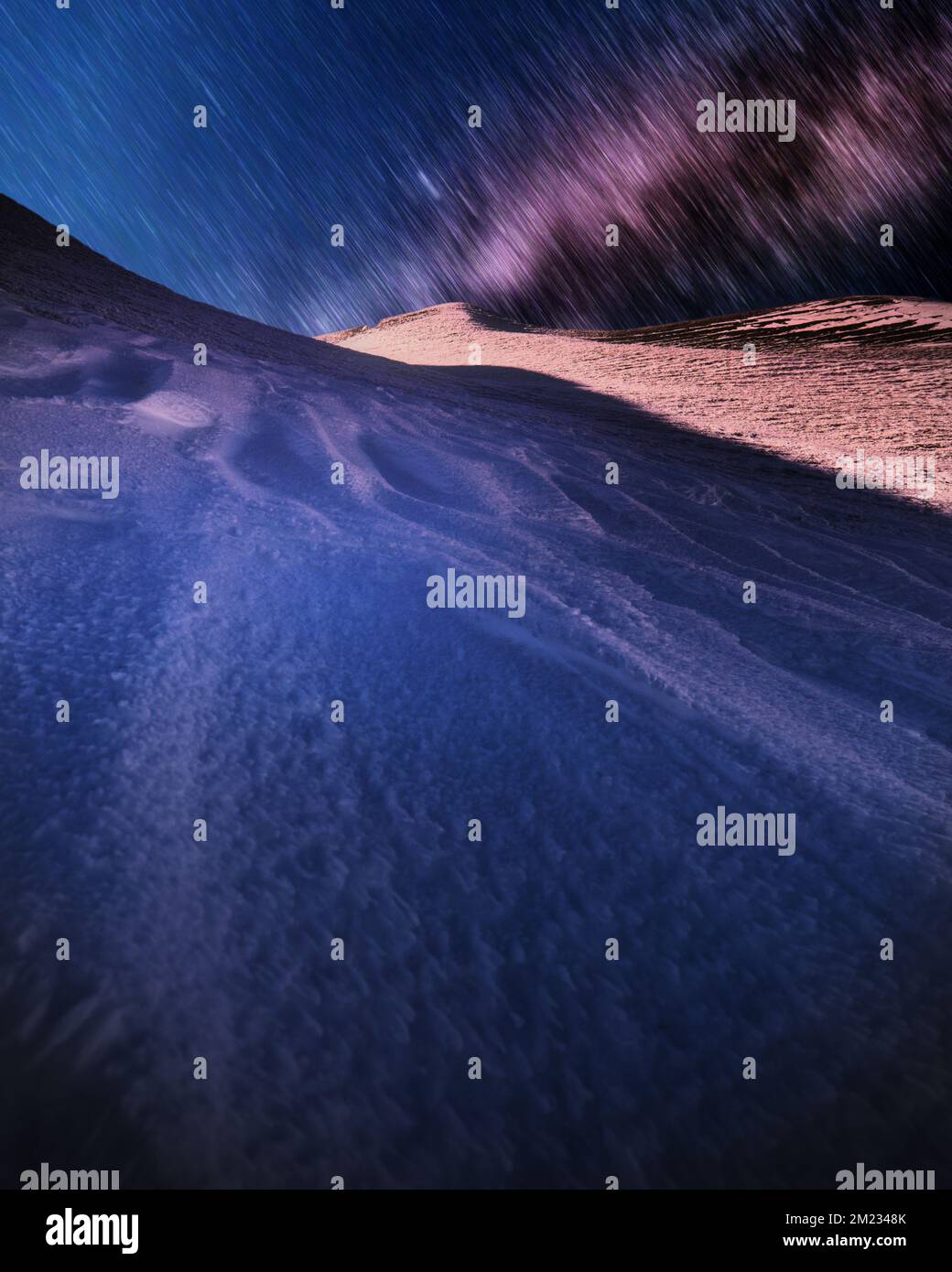 snowy landscape in winter season during night with a milky way ...