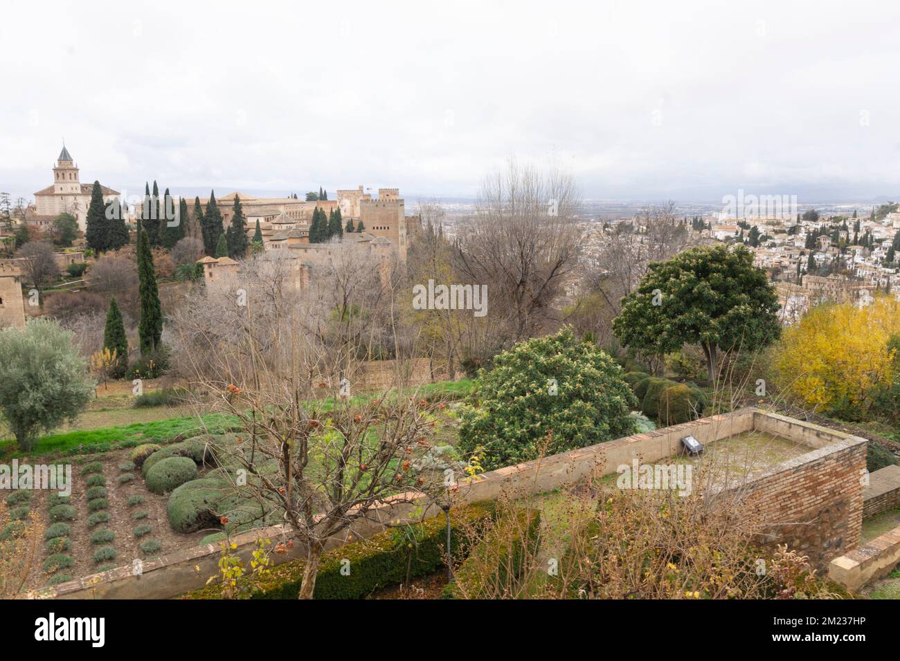 Generalife gardens and alhambra palace landscape in cloudy sunny day ...
