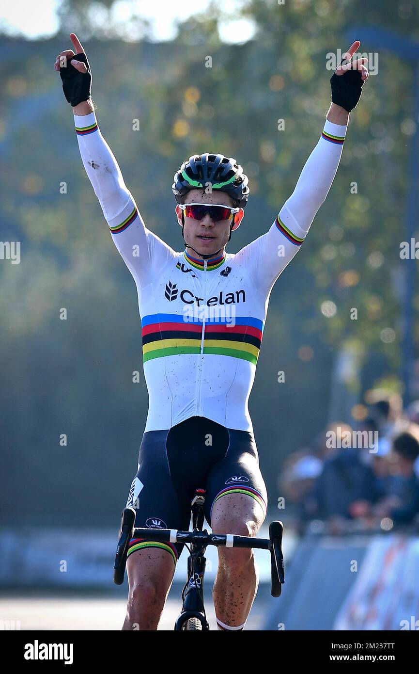 Belgian world champion Wout Van Aert celebrates as he crosses the ...