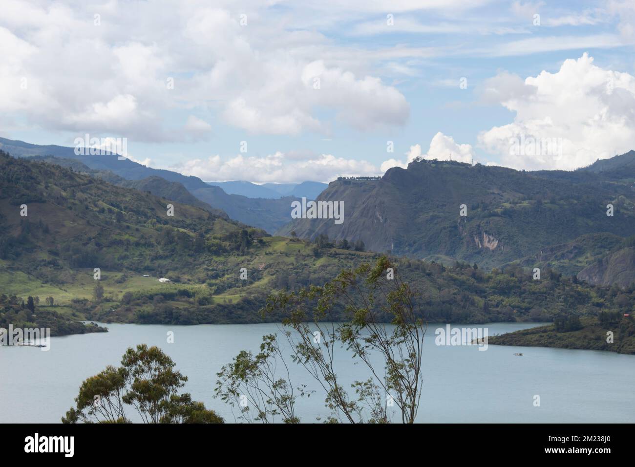 Andean mountain range landscape with blue sky and lake in sunny day ...