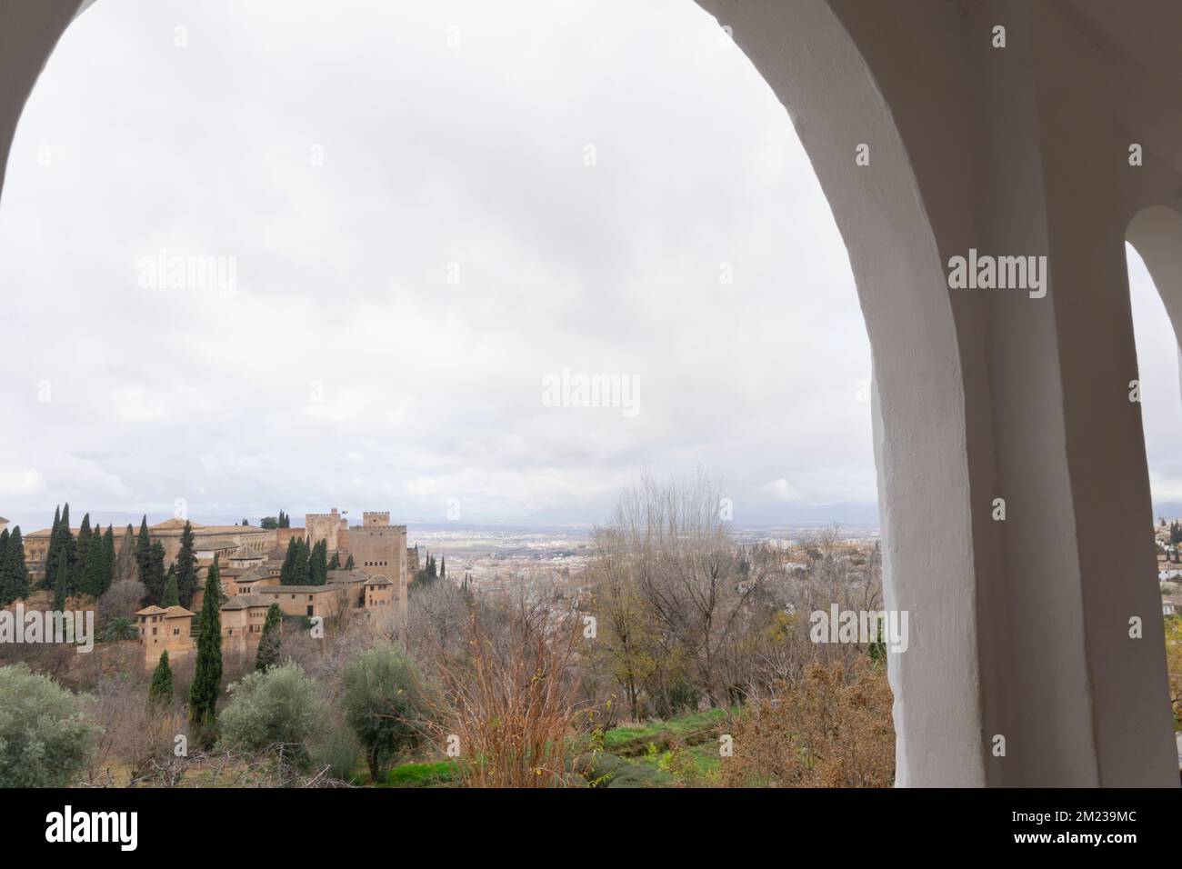 Beautiful view of alhambra palace from generalife gardens arc window ...