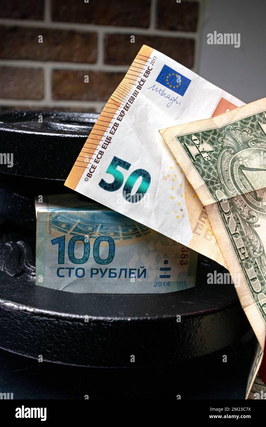 Russian 100 rubles, 50 euros, and dollars on top of each other and ...