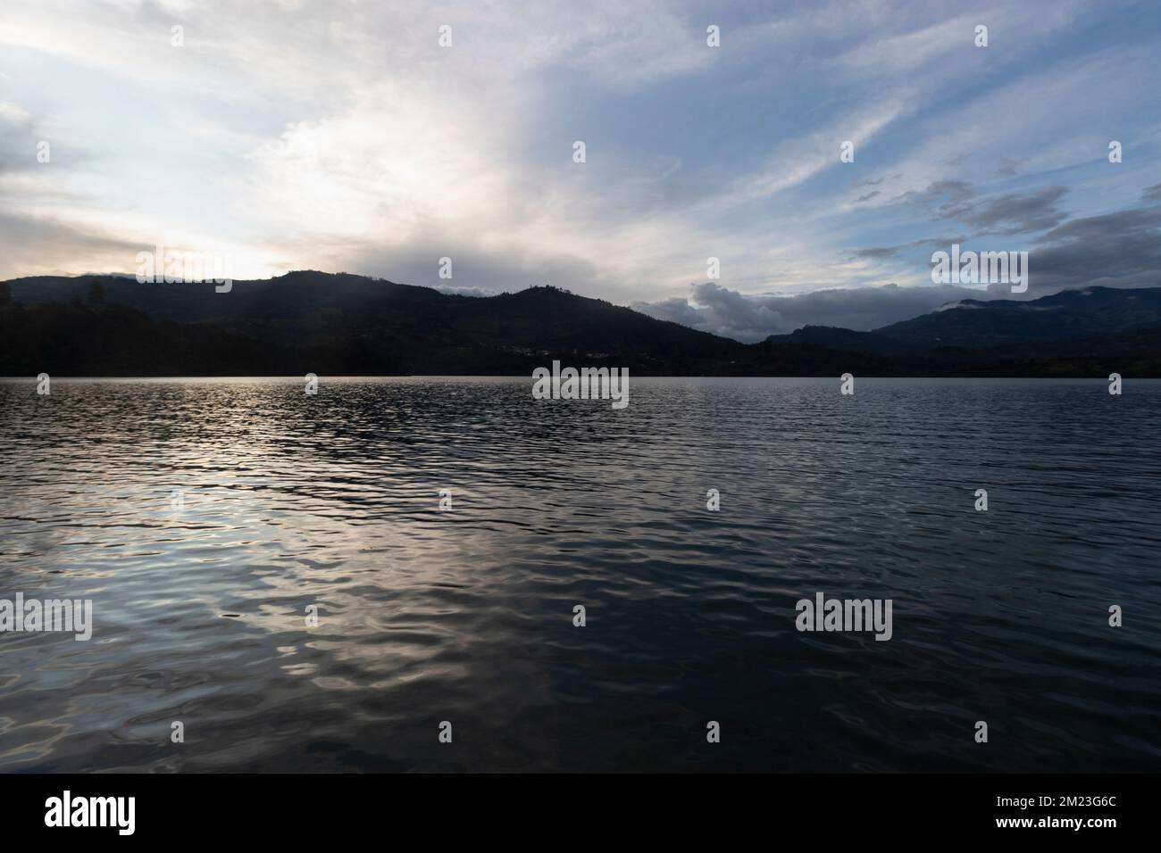 Beautiful colombian lake and mountain range landscape in colorful ...
