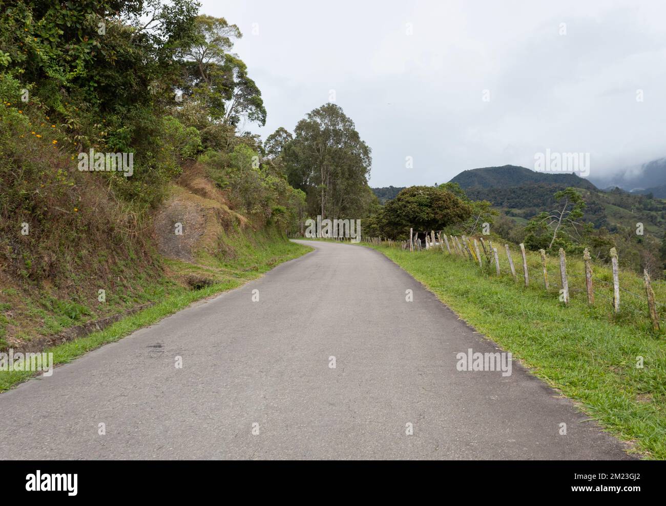 Colombian mountain country road with cloudy mountain range at ...
