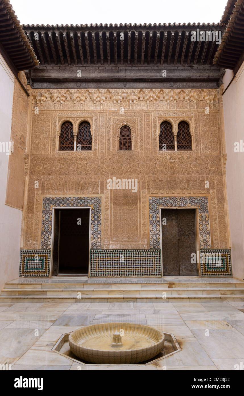 Comares palace small interior yard with a font and islamic architecture ...