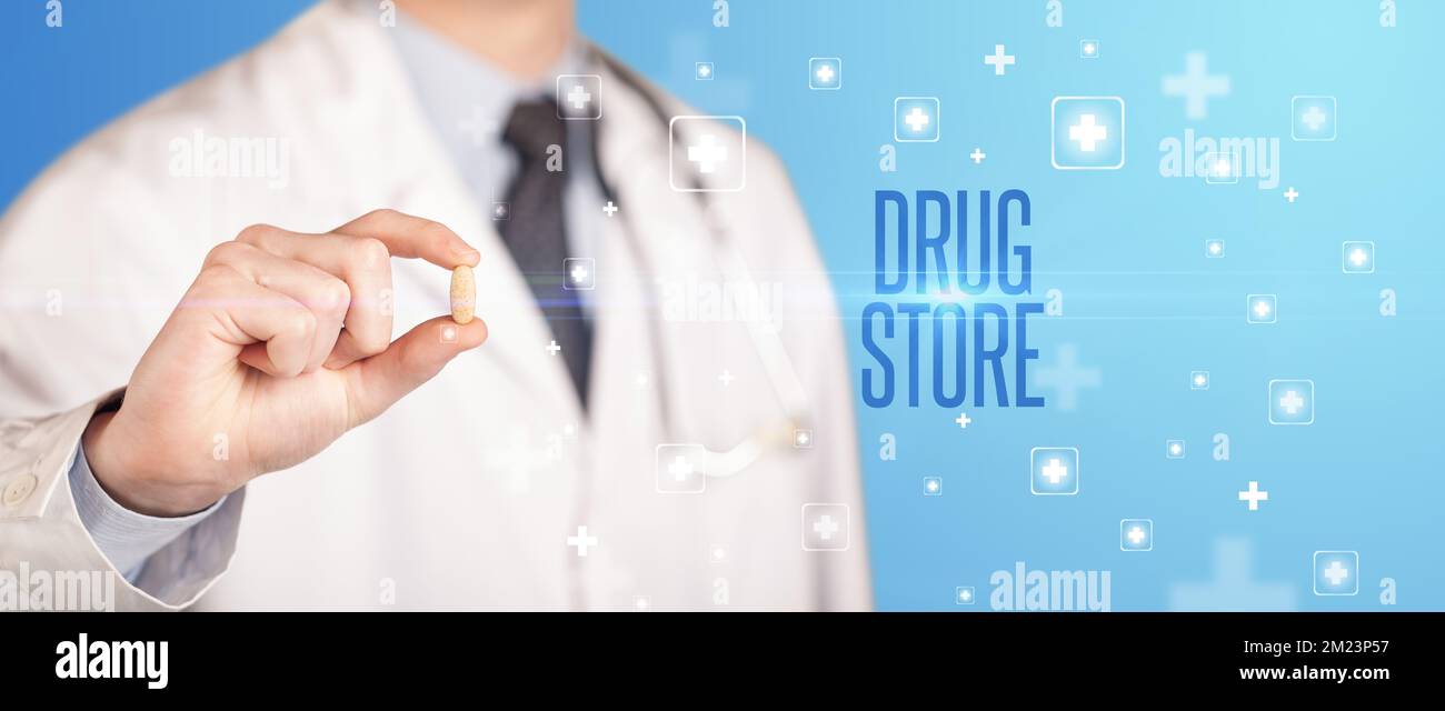 Close-up of a doctor giving a pill Stock Photo - Alamy