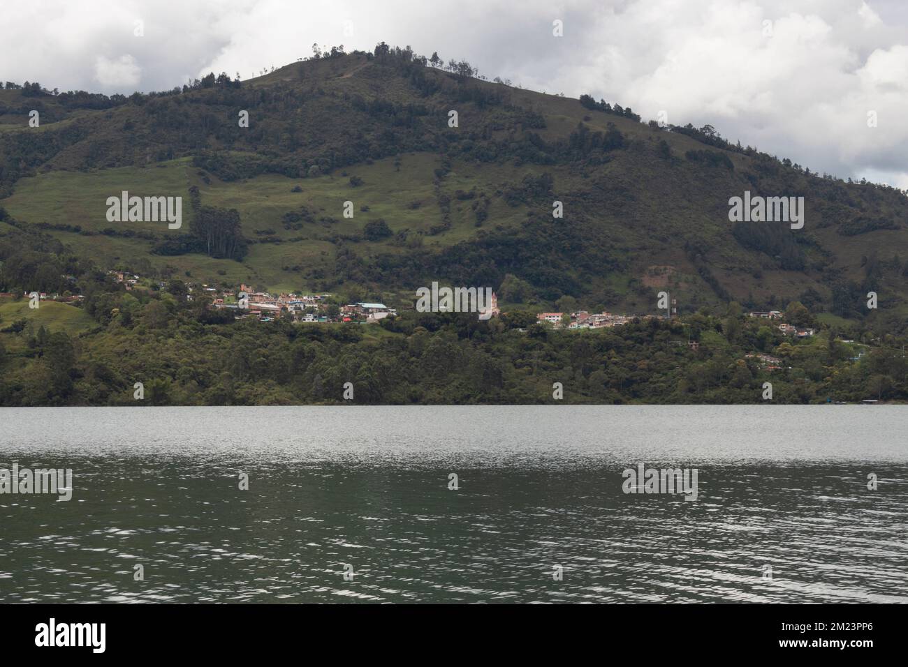 Colombian gachala town viewed from guavio reservoir lake edge with ...