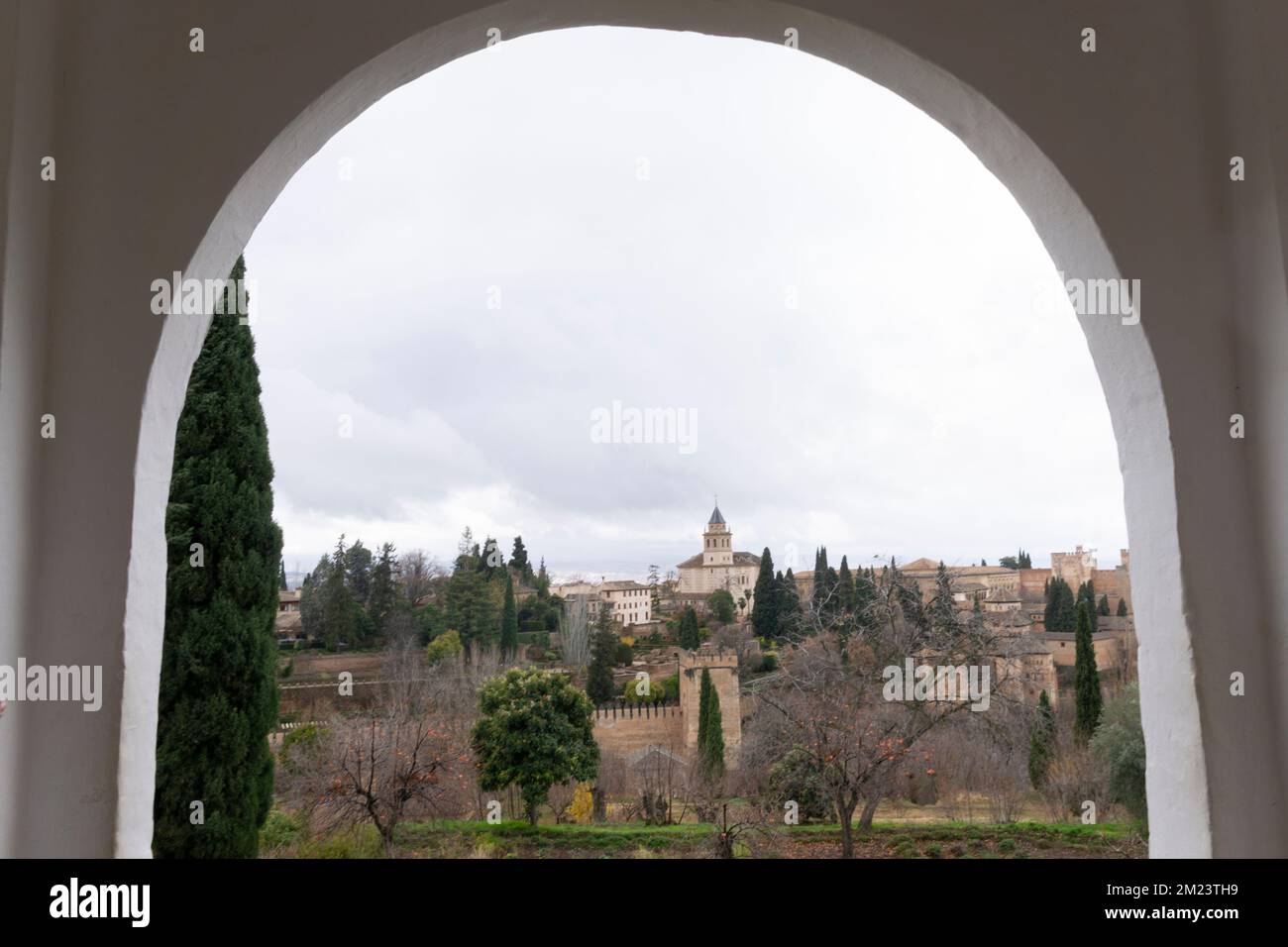 La alhambra palace and generalife gardens viewed through an ancient ar ...