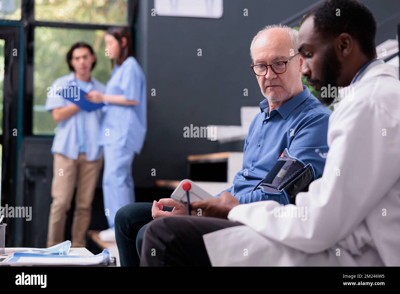 Cardiologist doctor measuring blood pressure and hypertension with ...