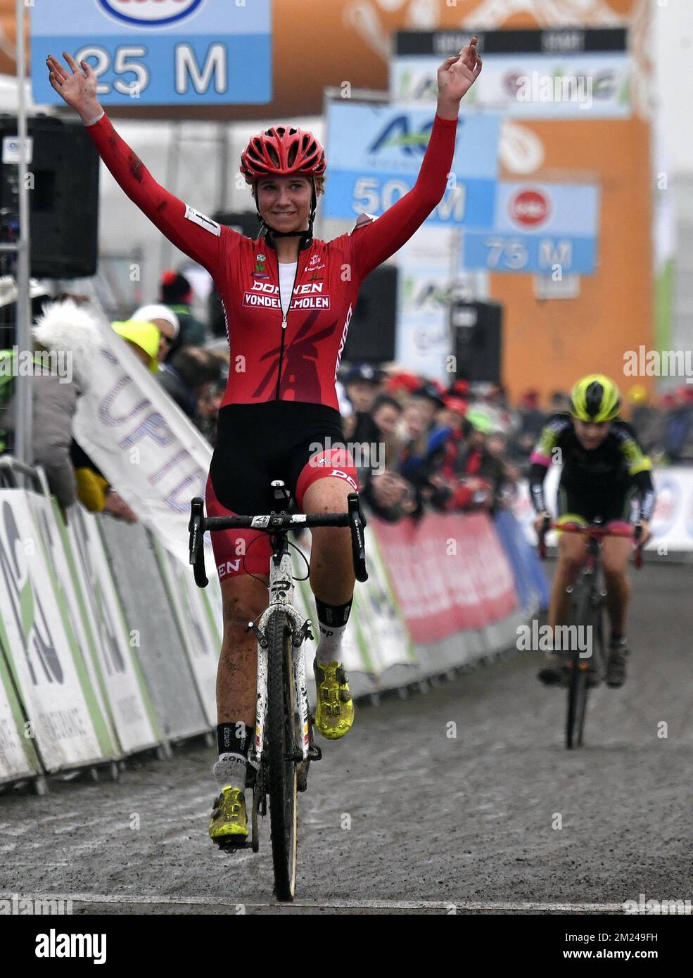 Belgian Tess Van Loy celebrates as she crosses the finish line at the ...