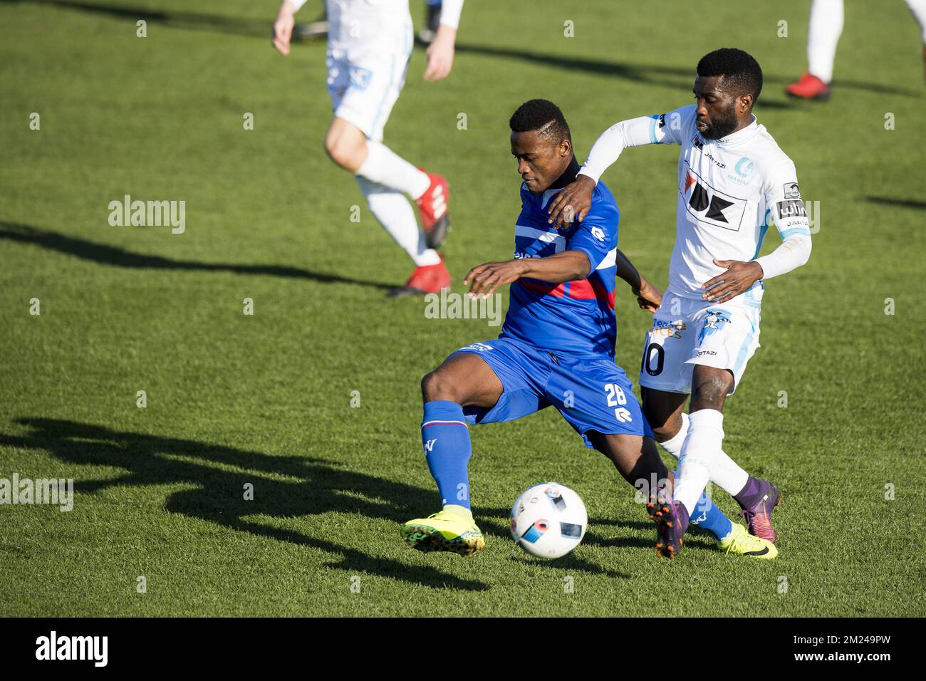 Willem II's Asumah Abubakar and Gent's Ibrahim Rabiu fight for the ball ...