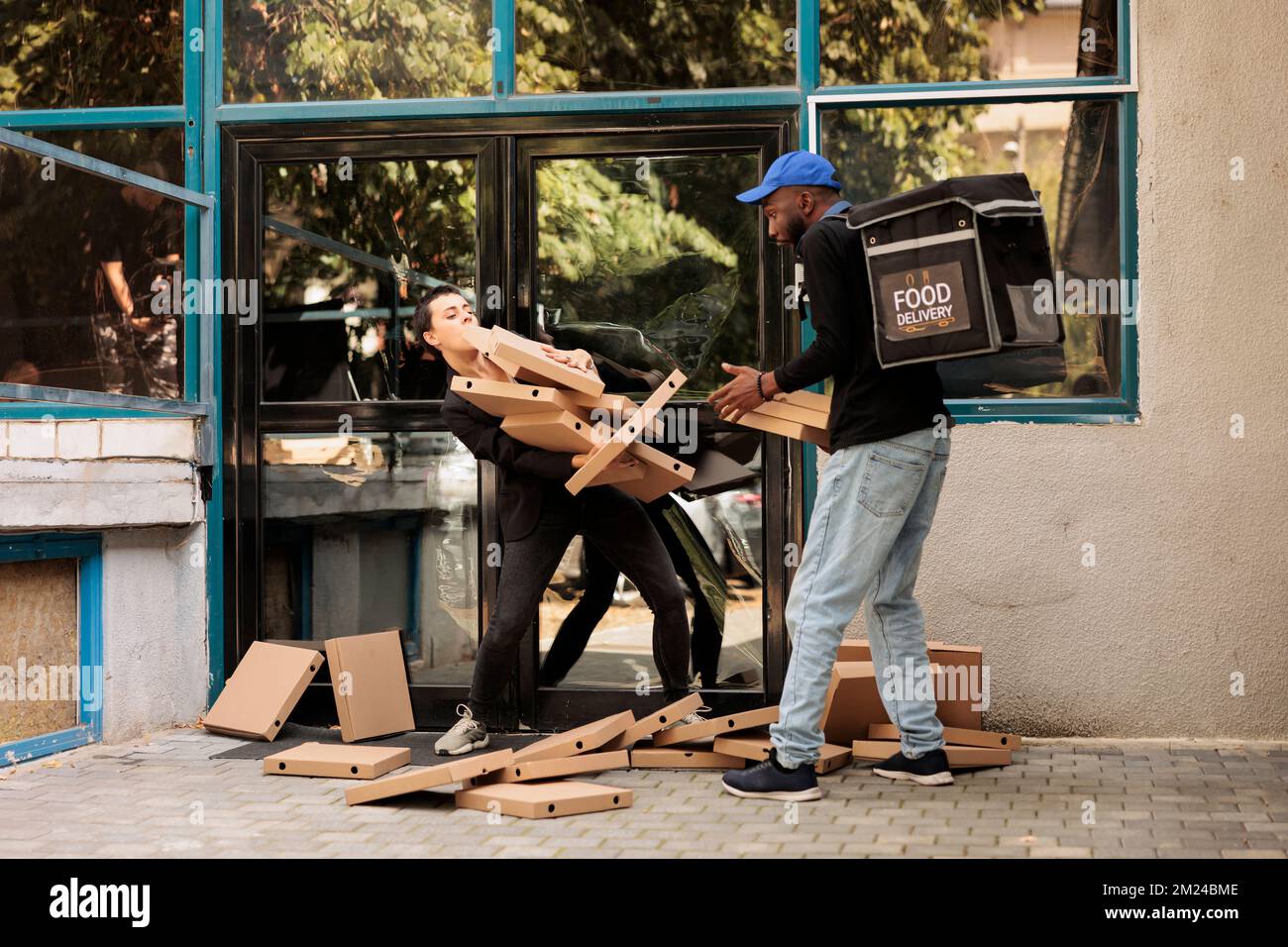 Shocked food delivery customer catching falling pizza boxes pile ...