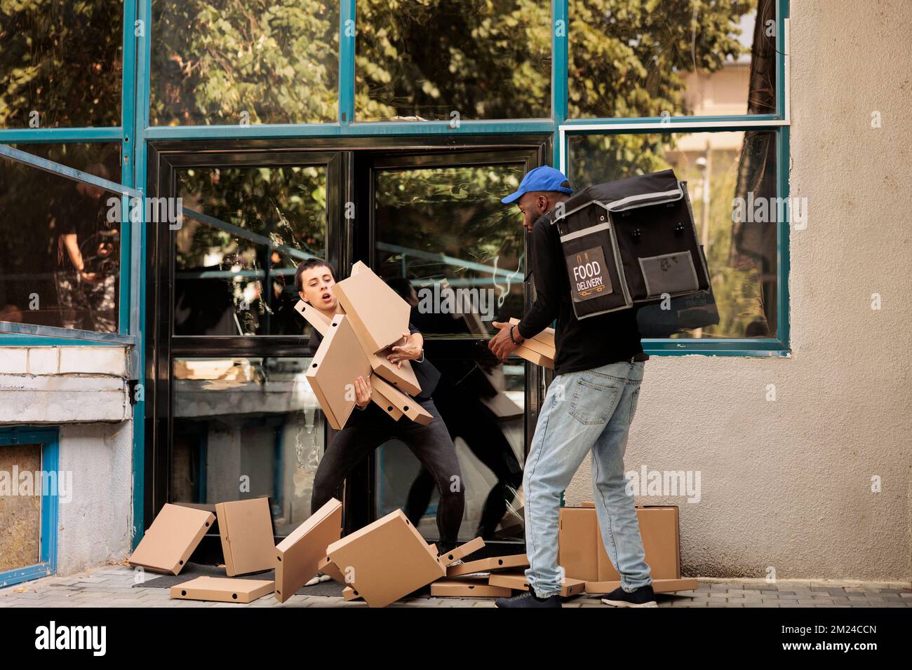 Delivery man falling stack boxes hi-res stock photography and images ...
