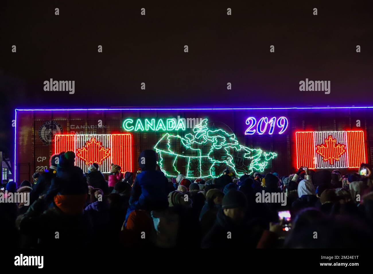 People watch the arrival of the Canadian Pacific train Christmas time ...