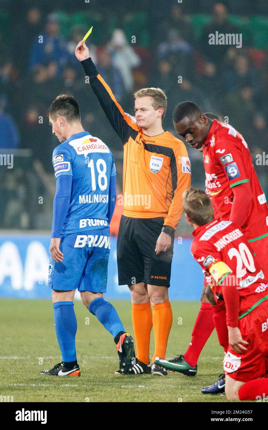 Genk's Ruslan Malinovsky receives a yellow card from the referee during ...