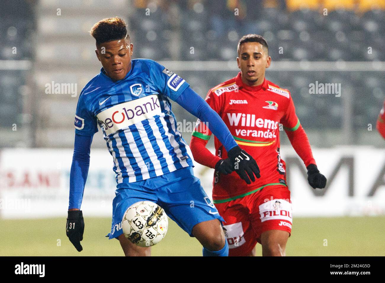 Genk's Leon Bailey and Oostende's Yassine El Ghanassy fight for the ...